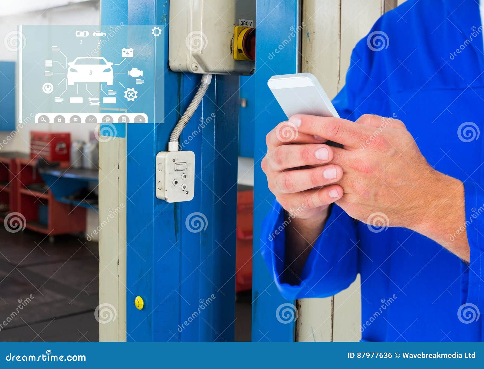 Mechanic Using Smartphone in Garage with Car Mechanic Interface Stock ...