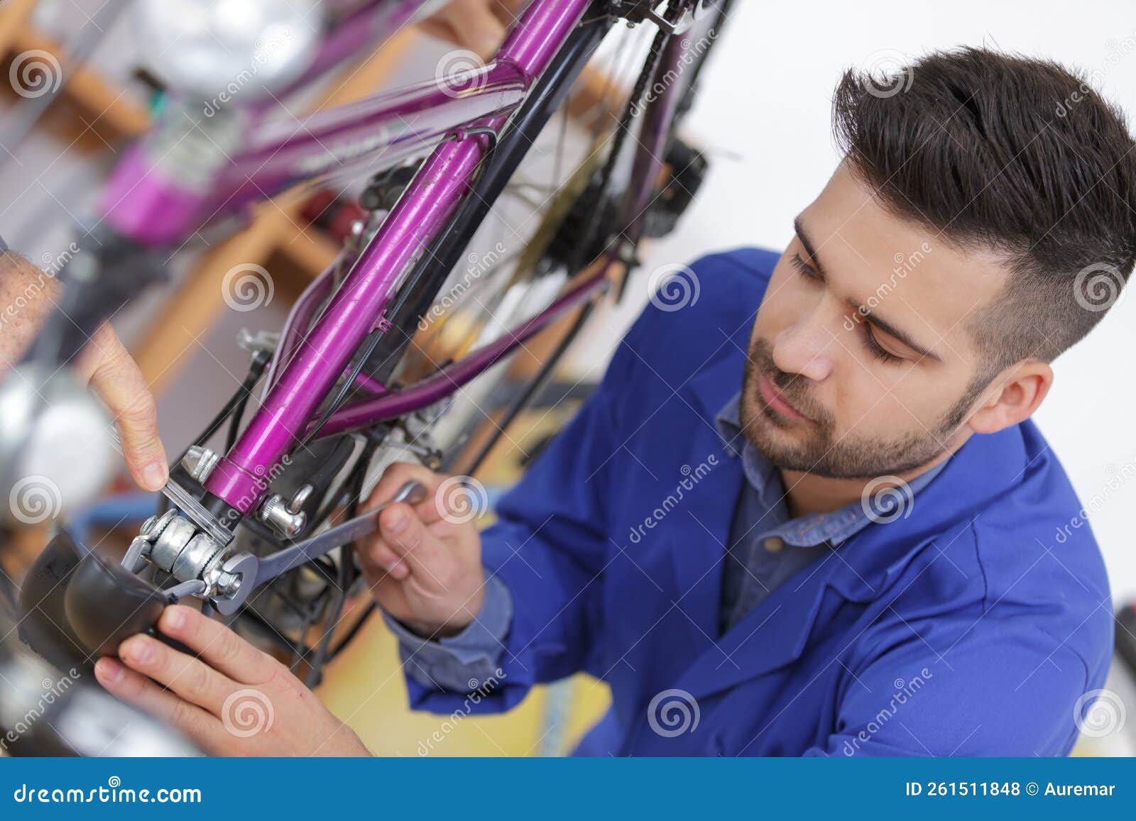 Mechanic Using Spanner on Bicycle Stock Photo - Image of maintenance ...