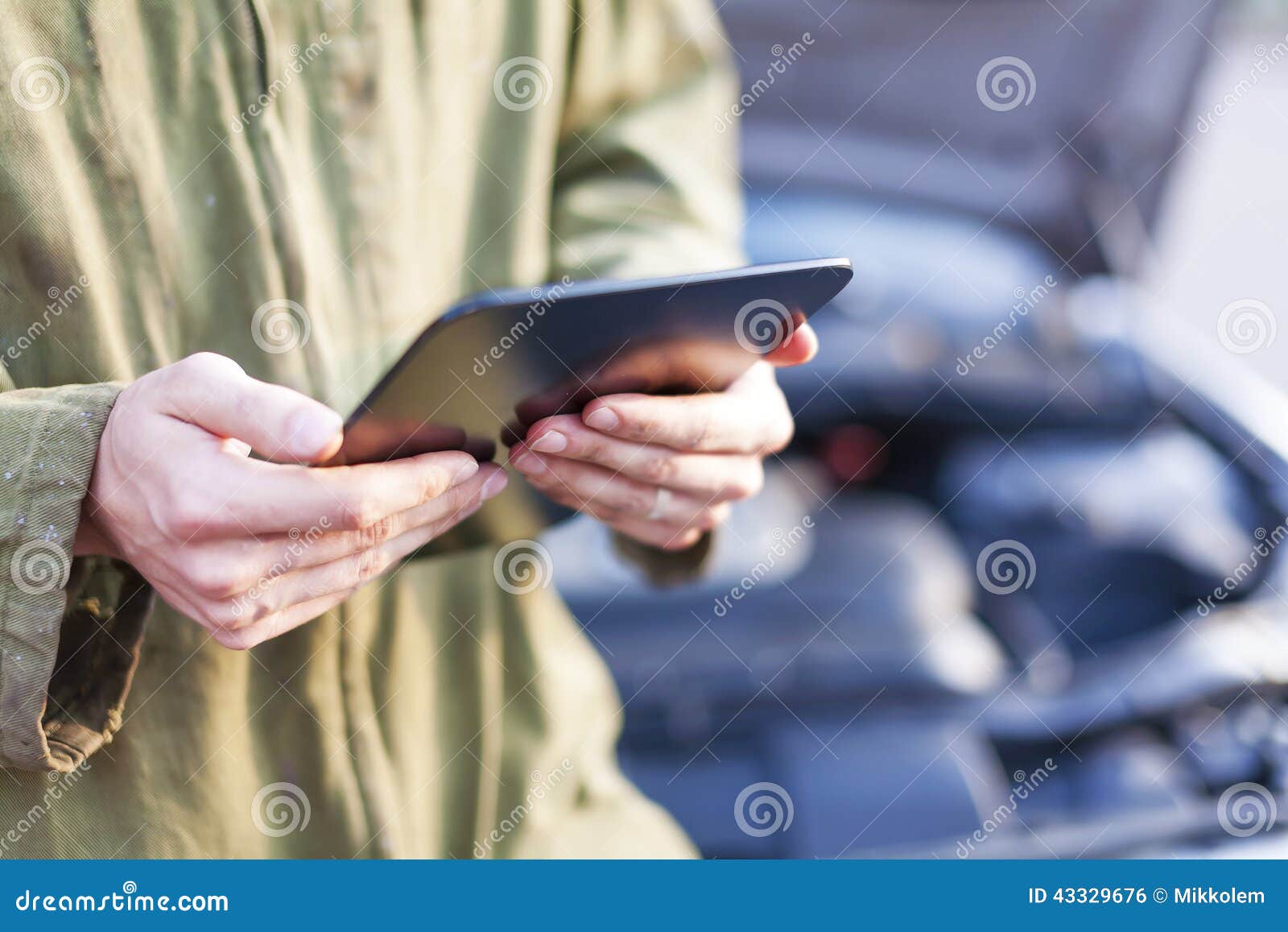 Mechanic Using Tablet Computer Stock Photo - Image of fixing, green ...