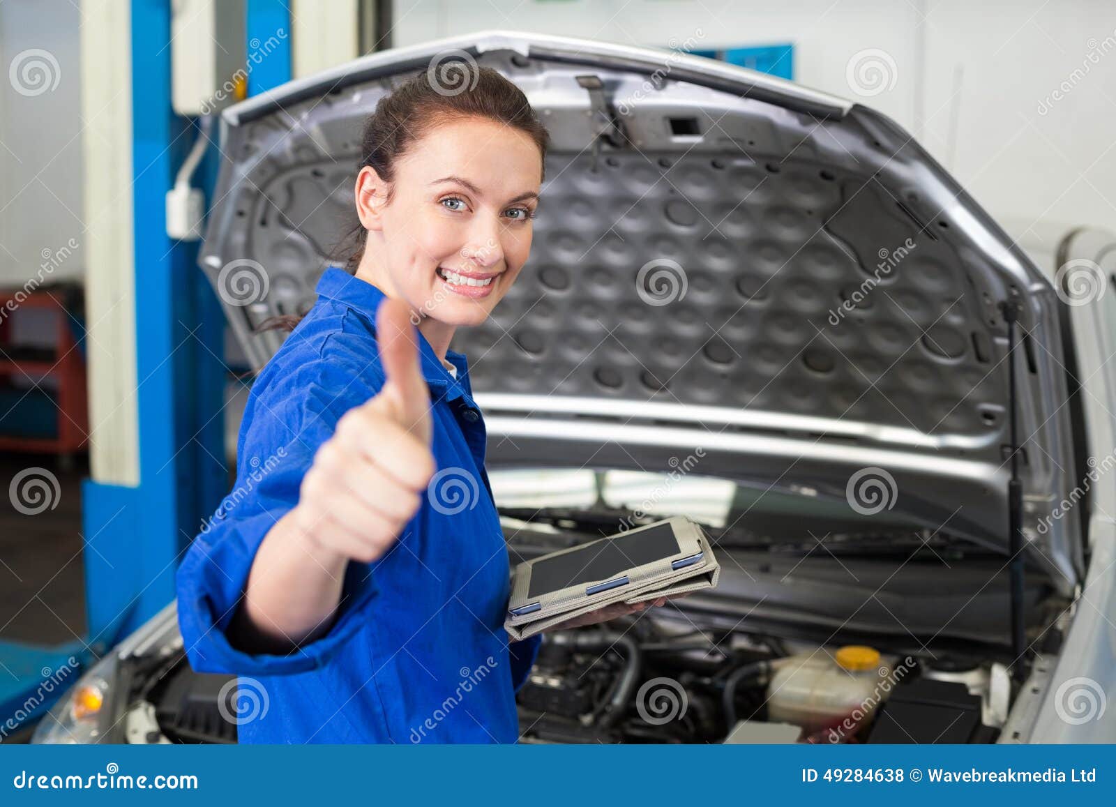 Mechanic Using Tablet To Fix Car Stock Photo - Image of coveralls ...