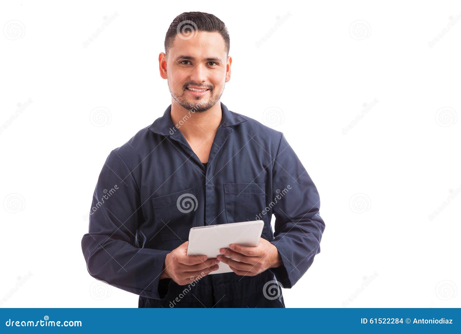 Mechanic using technology stock photo. Image of overalls - 61522284