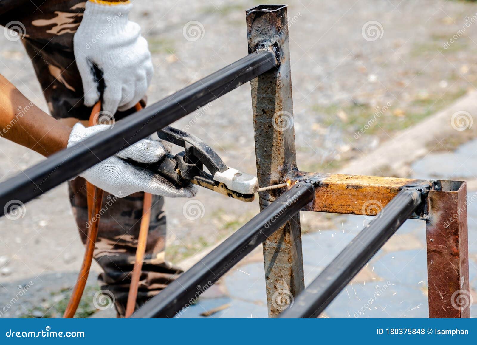 The Mechanic is Using a Welding Machine To Weld Steel Stock Photo ...