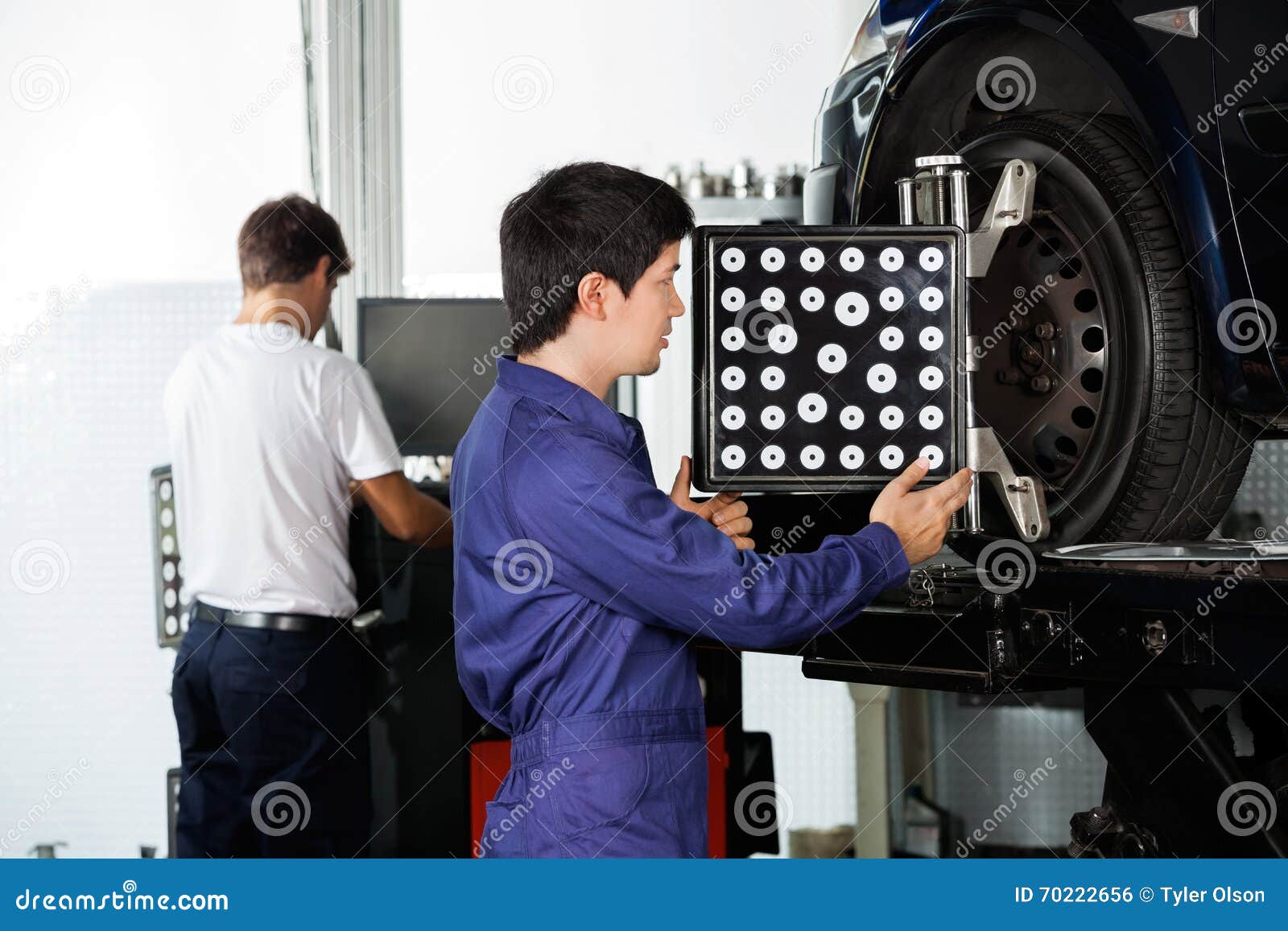 Mechanic Using Wheel Aligner on Car Stock Photo - Image of repairing ...