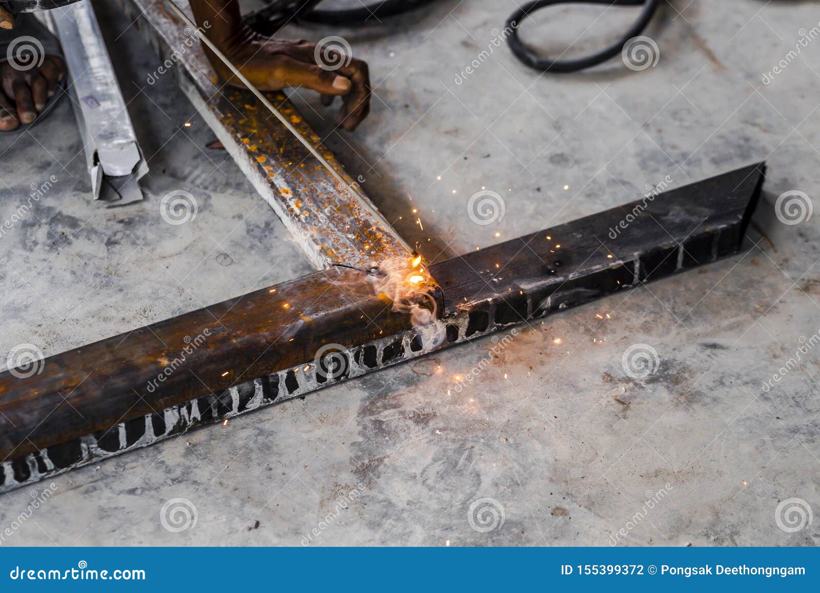 Weld iron until it sparked stock photo. Image of machine - 155399372