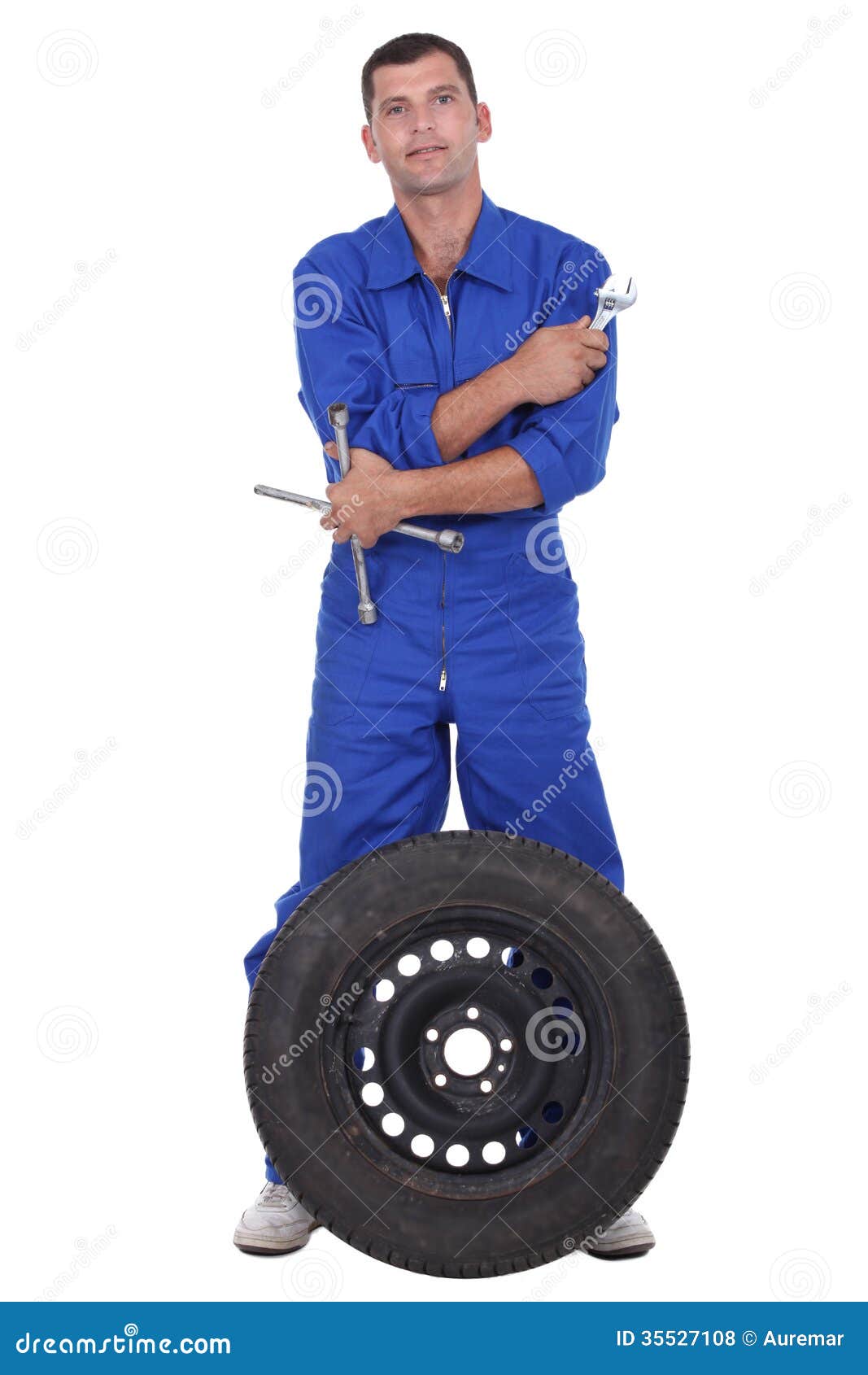 Mechanic with wheel stock photo. Image of covered, knowledge - 35527108