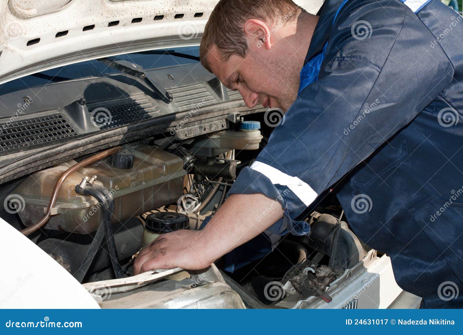 Mechanic at work stock image. Image of concentration - 24631017
