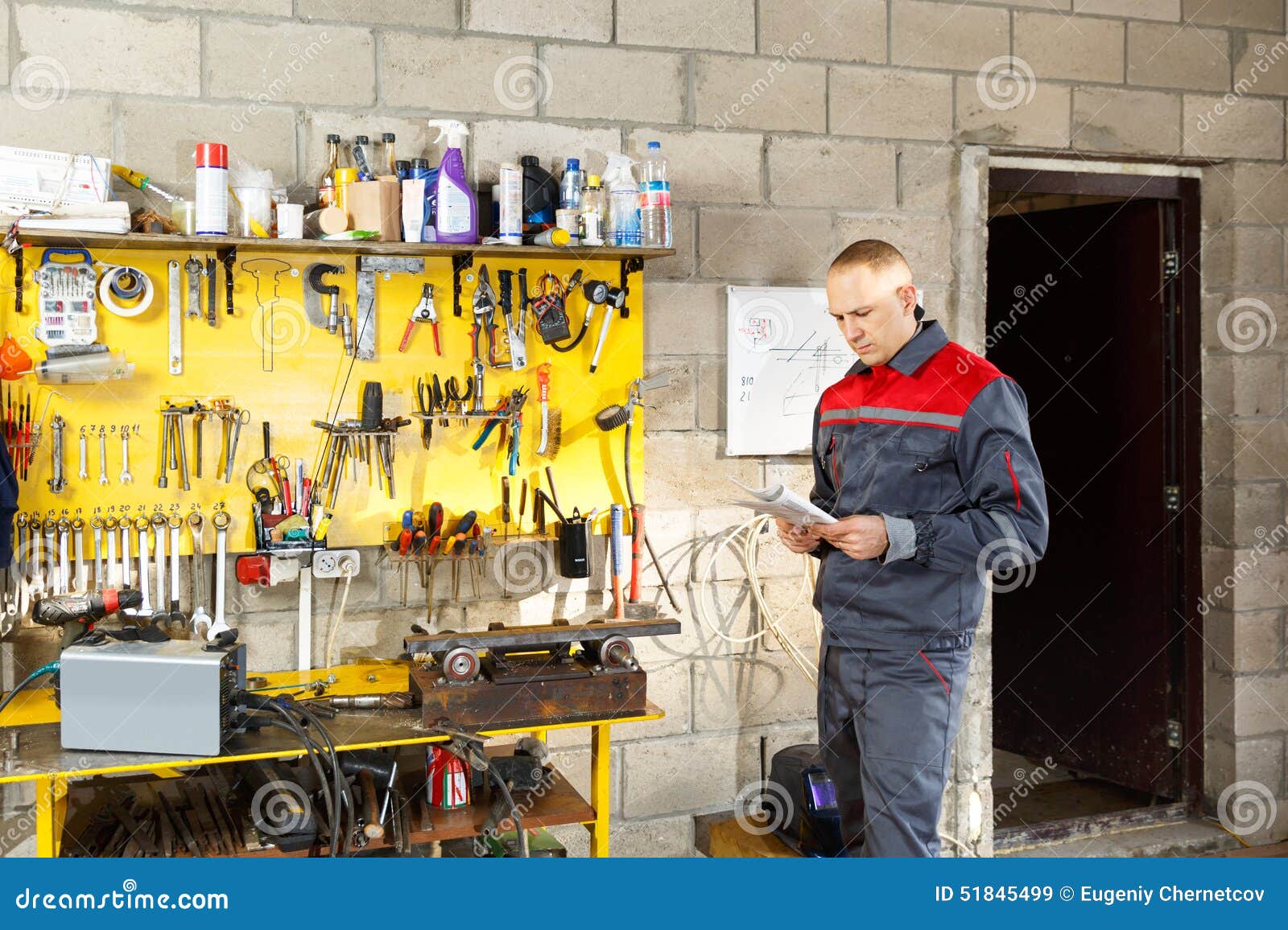 Mechanic Worker Studying His Instructions Stock Image - Image of ...