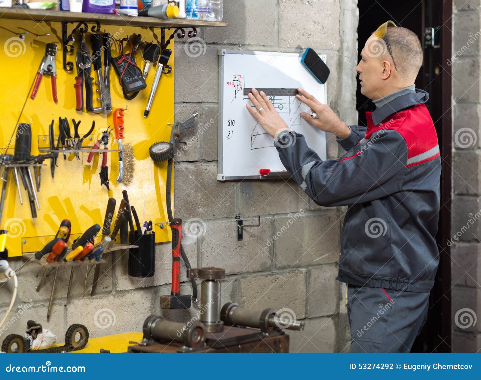 Mechanic Worker Studying His Instructions Stock Photo - Image of labor ...