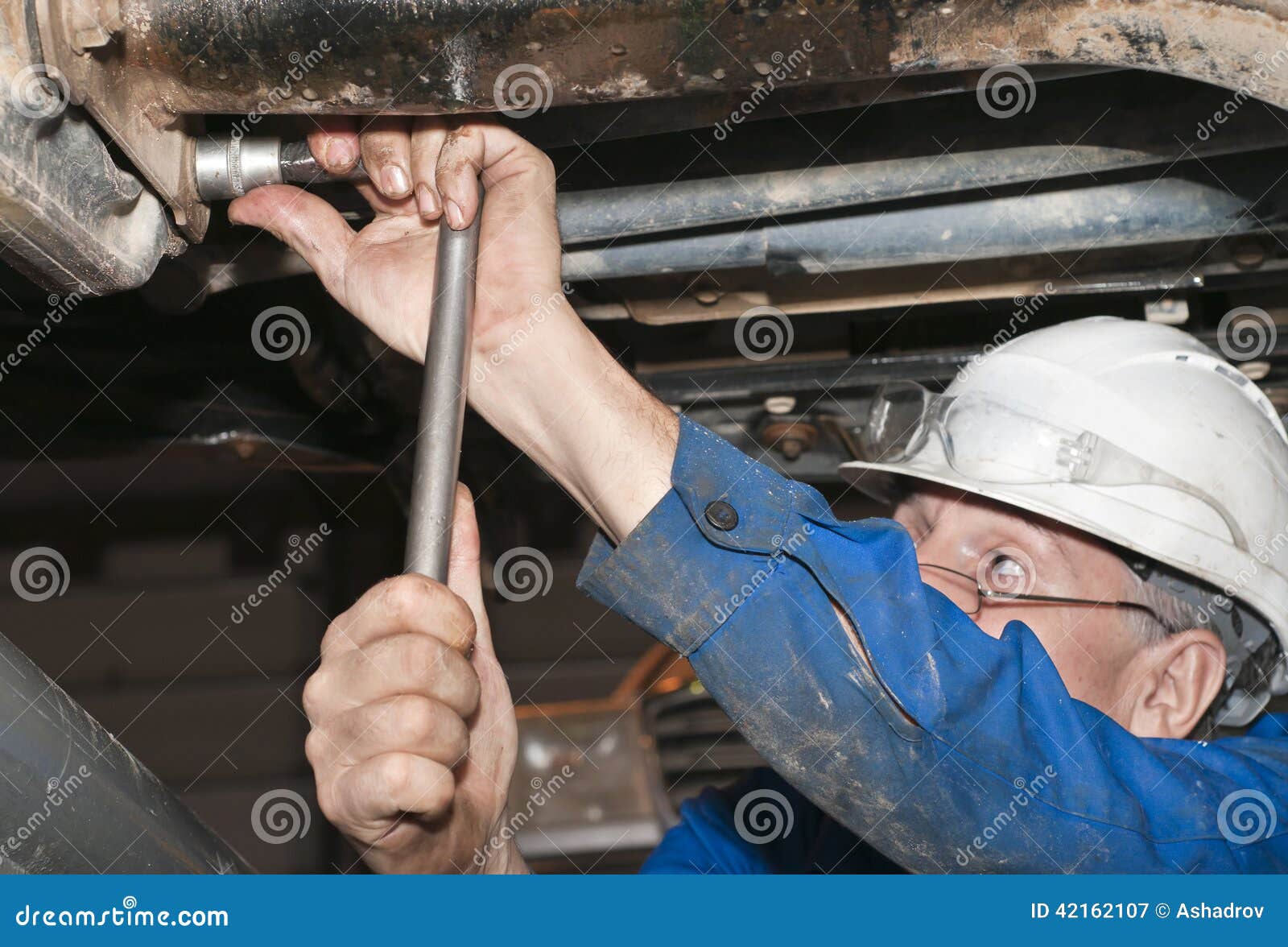 Mechanic Working on a Broken Down Vehicle Stock Image - Image of labor ...