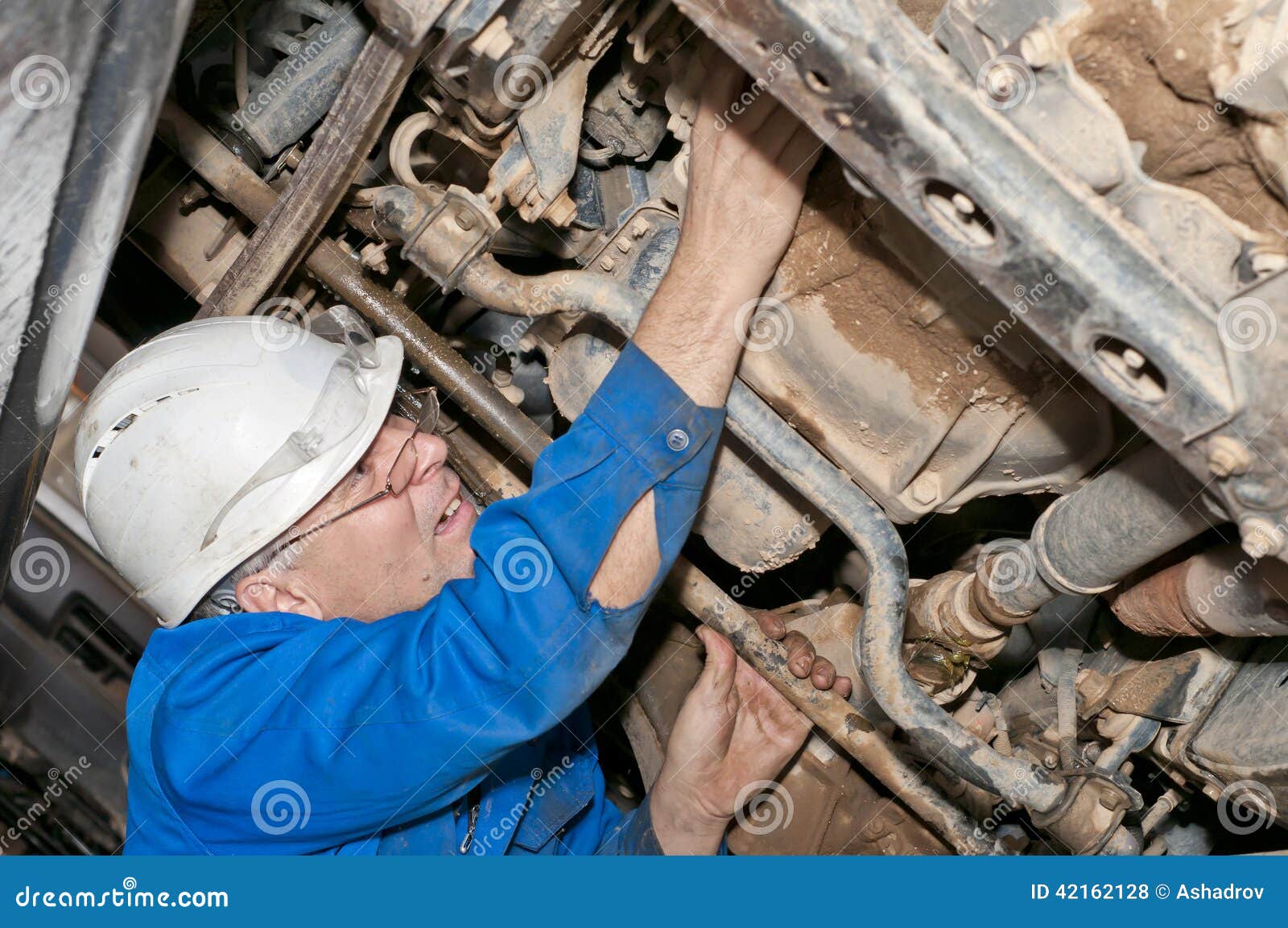 Mechanic Working on a Broken Down Vehicle Stock Photo - Image of poor ...