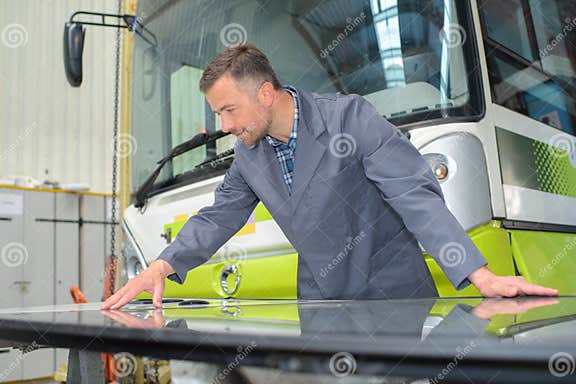 Mechanic working on bus stock image. Image of industry - 89109431