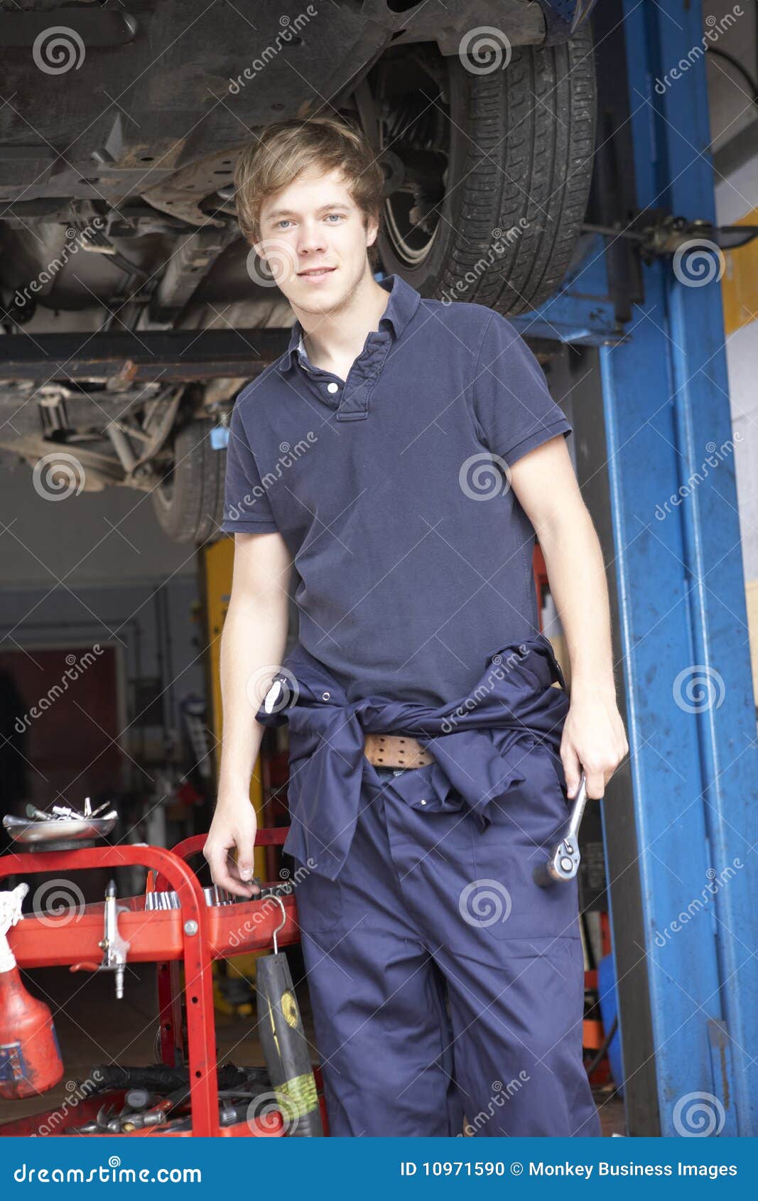 Mechanic working on car stock photo. Image of apprentice - 10971590