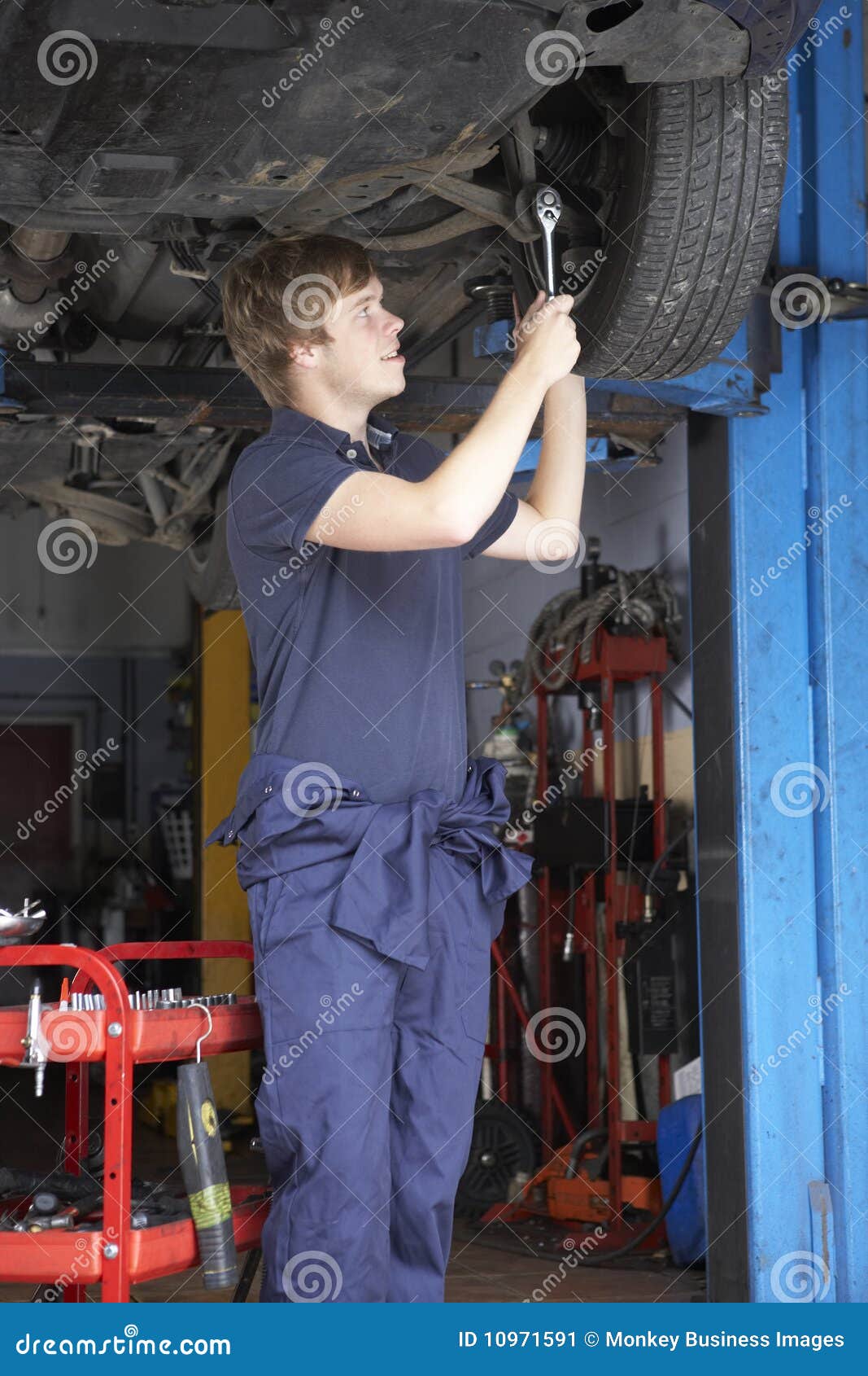 Mechanic working on car stock image. Image of small, automobile - 10971591