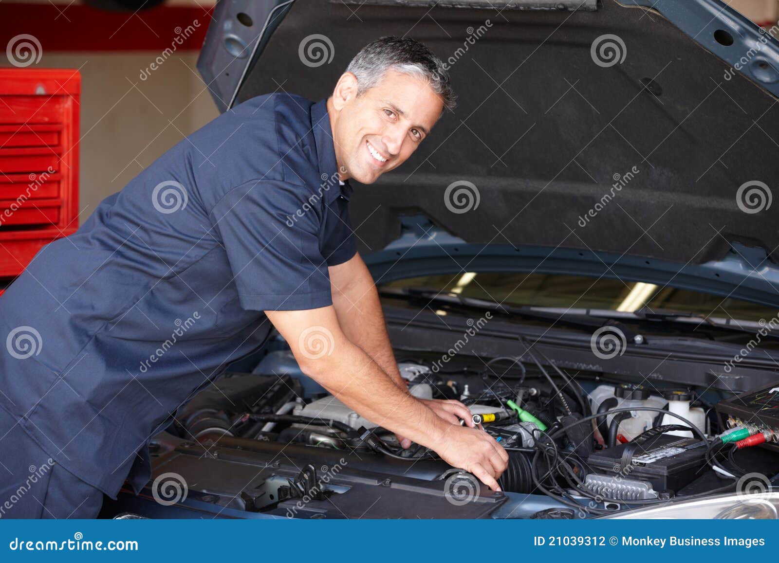 Mechanic working on car stock photo. Image of race, garage - 21039312