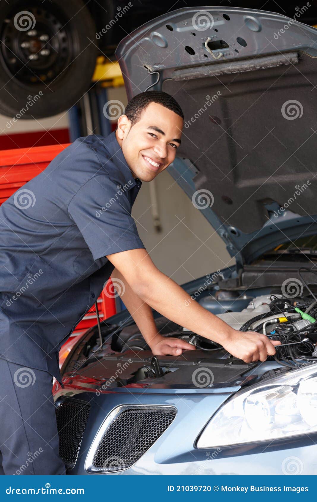 Mechanic working on car stock photo. Image of race, camera - 21039720