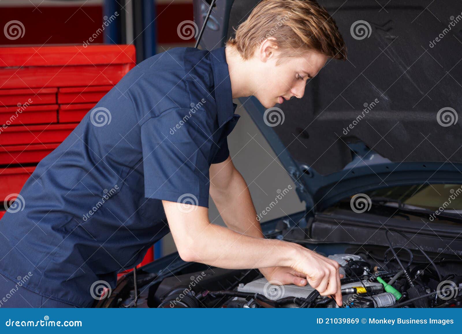 Mechanic working on car stock image. Image of adult, serious - 21039869