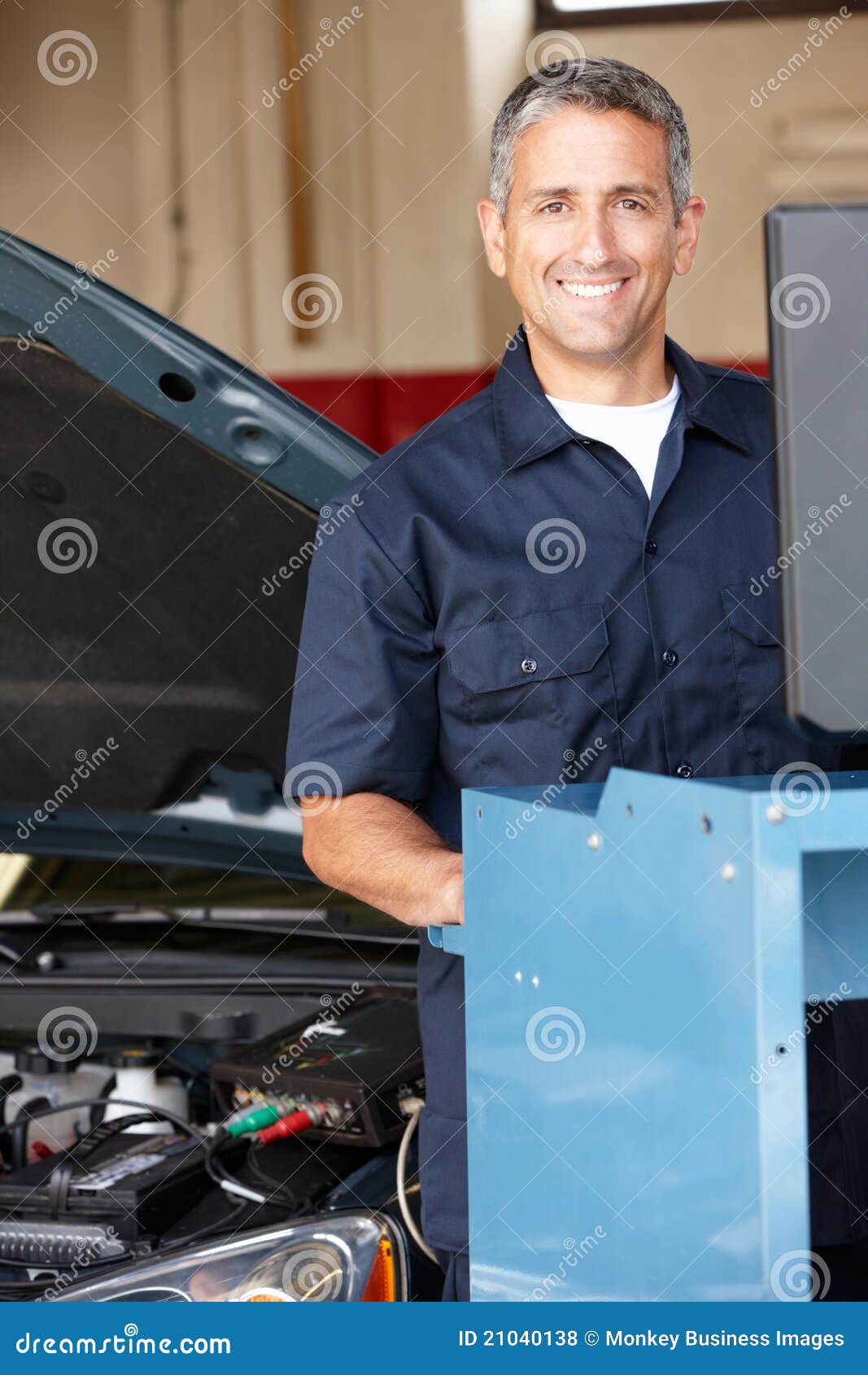 Mechanic working on car stock photo. Image of people - 21040138