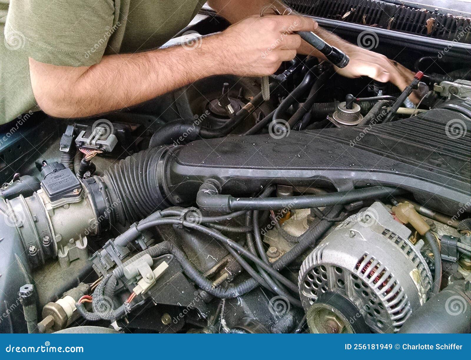 Mechanic Working on Car Engine with Flashlight Stock Image - Image of ...