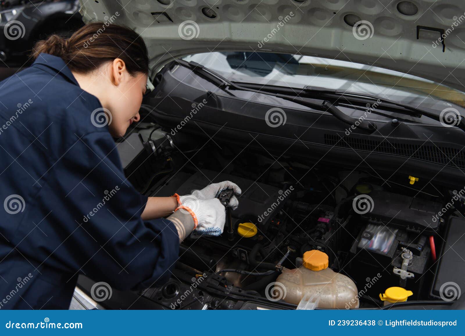 Mechanic Working with Car Engine in Stock Photo - Image of indoors ...