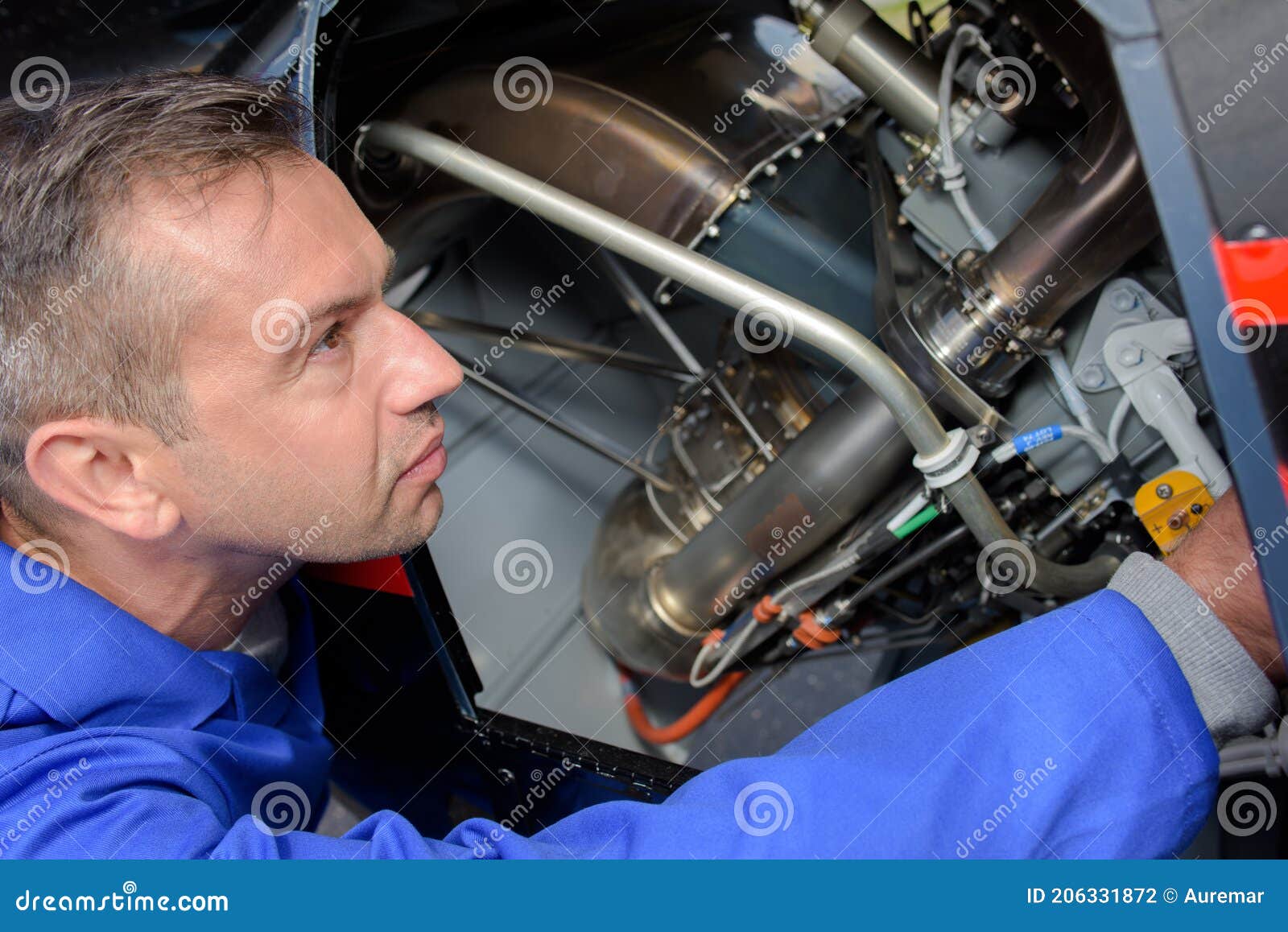 Mechanic working on engine stock photo. Image of profile - 206331872