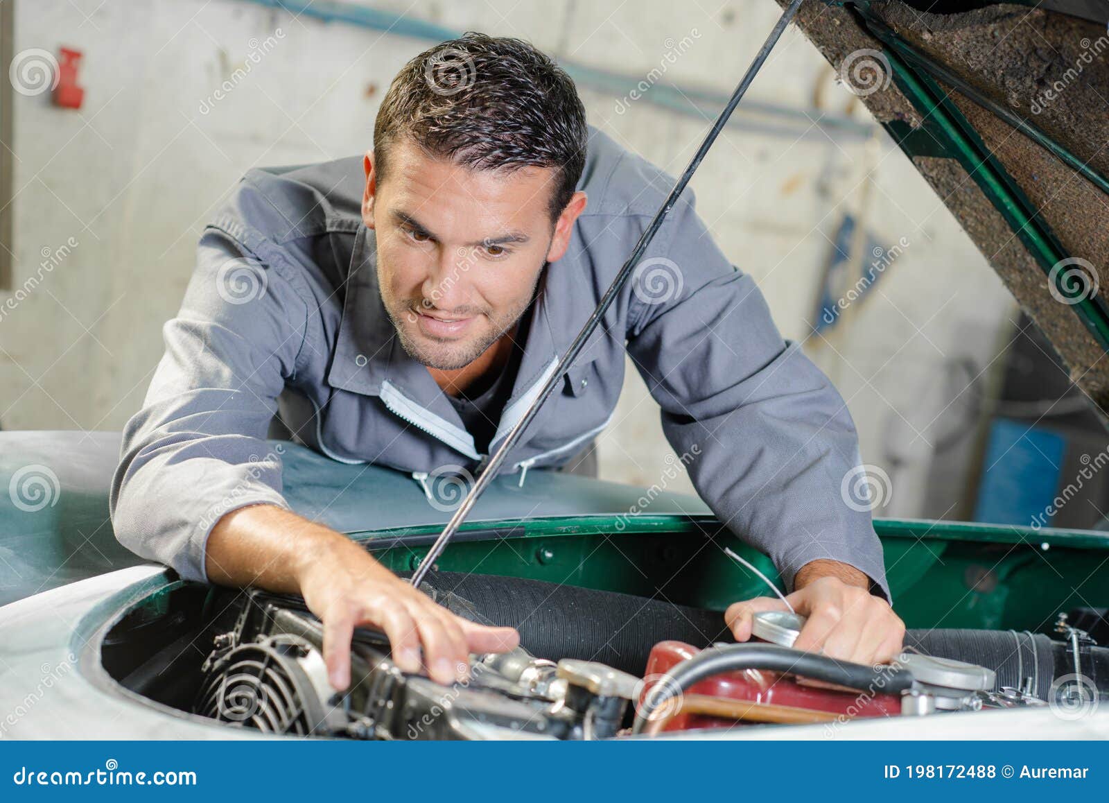 Mechanic Working in Engine Bay Stock Photo - Image of support ...