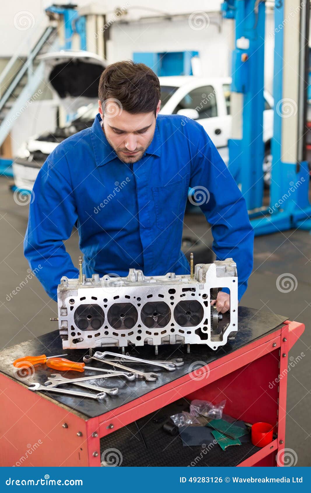 Mechanic Working on an Engine Stock Photo - Image of caucasian, person ...