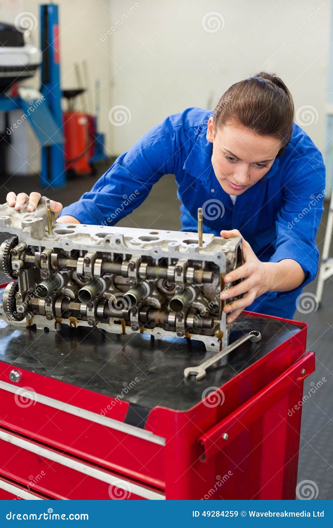 Mechanic Working on an Engine Stock Image - Image of examining, fixing ...