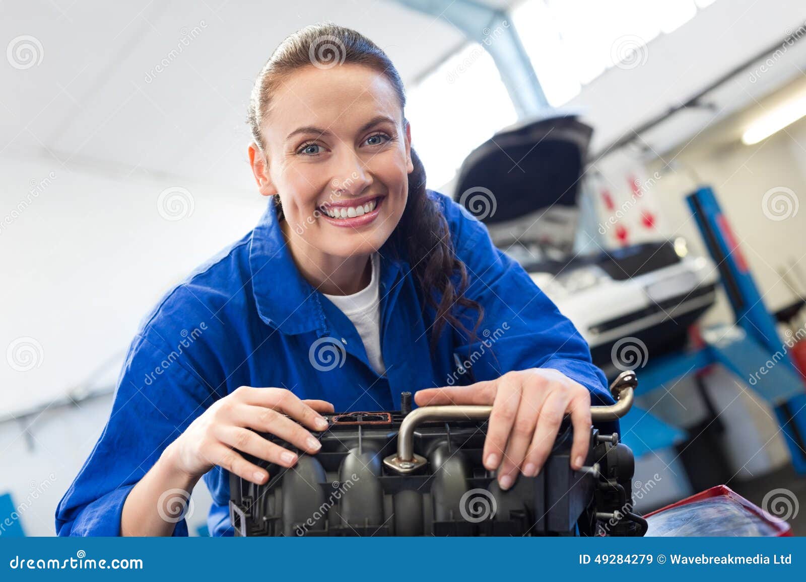 Mechanic Working on an Engine Stock Image - Image of female, looking ...