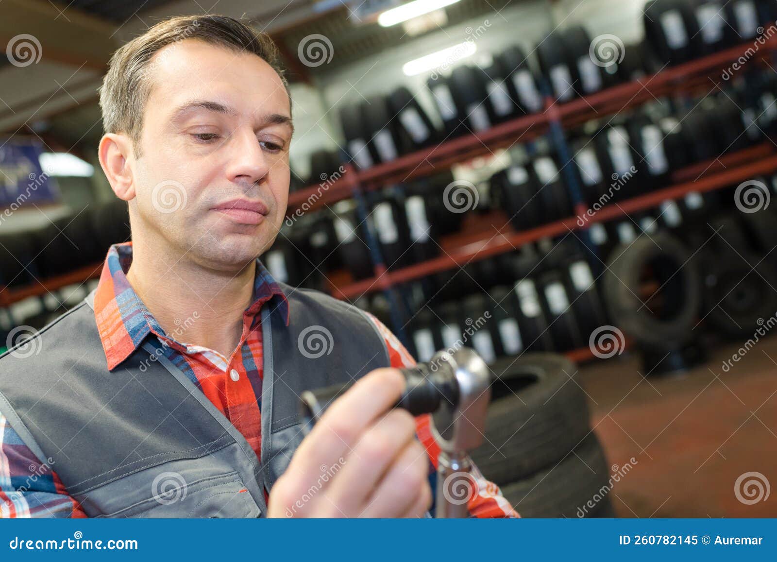 Mechanic working at garage stock image. Image of toolbox - 260782145