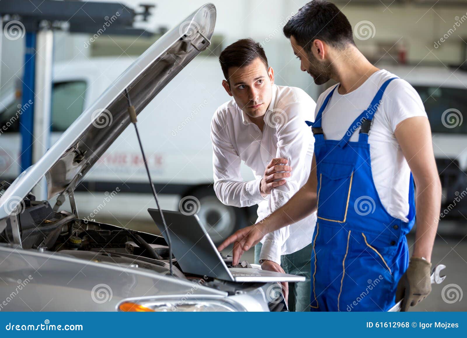 Mechanic Working on Laptop Computer Stock Photo - Image of checkup ...