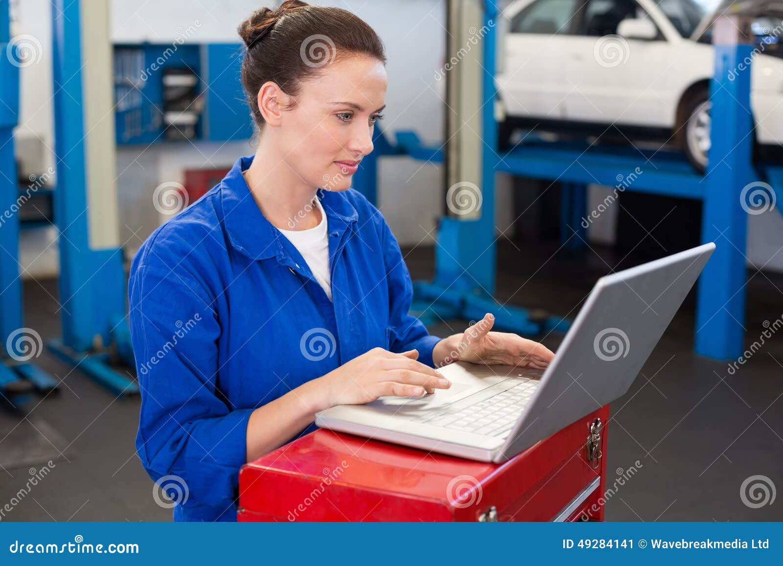 Mechanic Working on a Laptop Stock Image - Image of indoors, vehicle ...