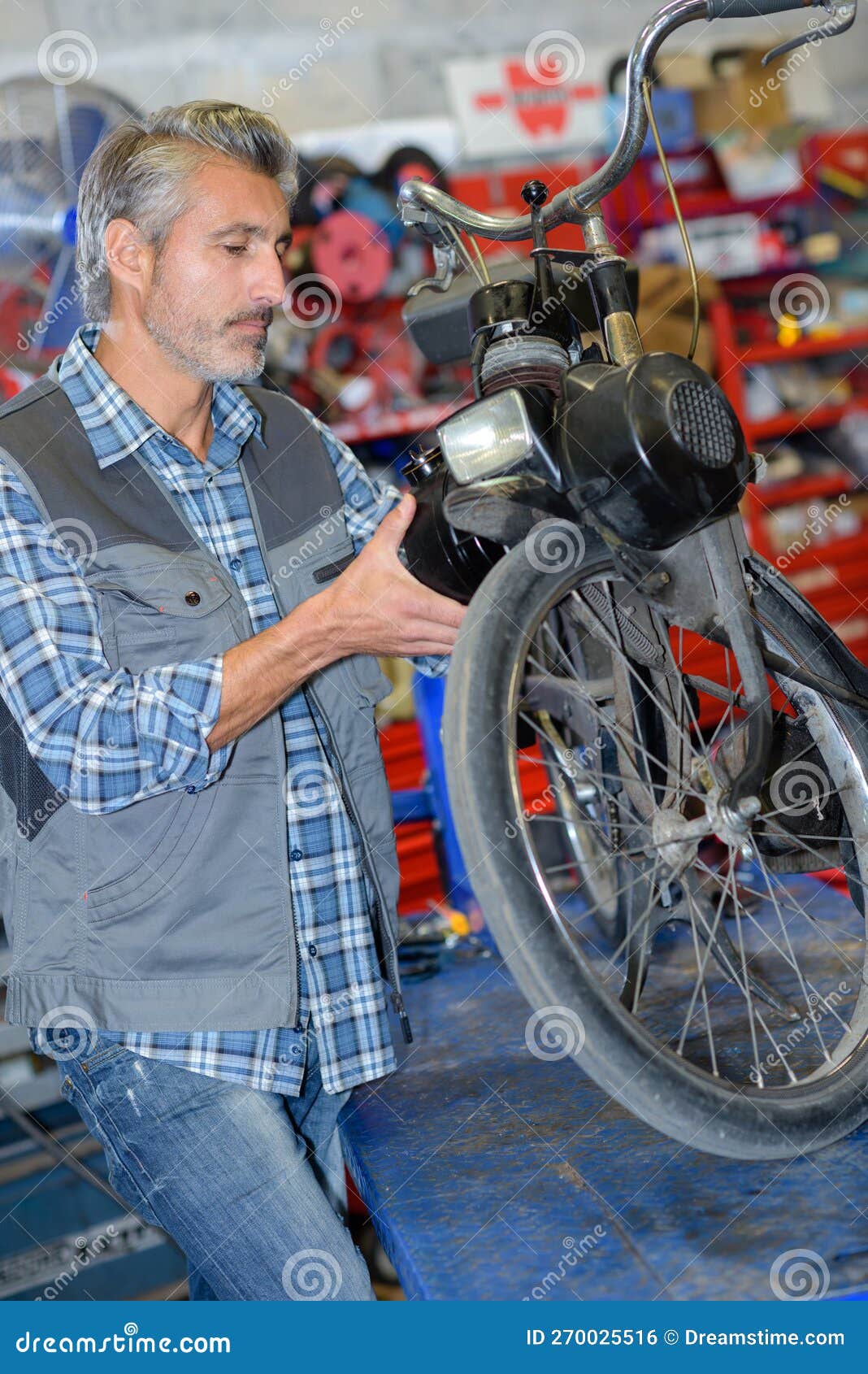 Mechanic Working on Motorised Bicycle Stock Photo - Image of french ...