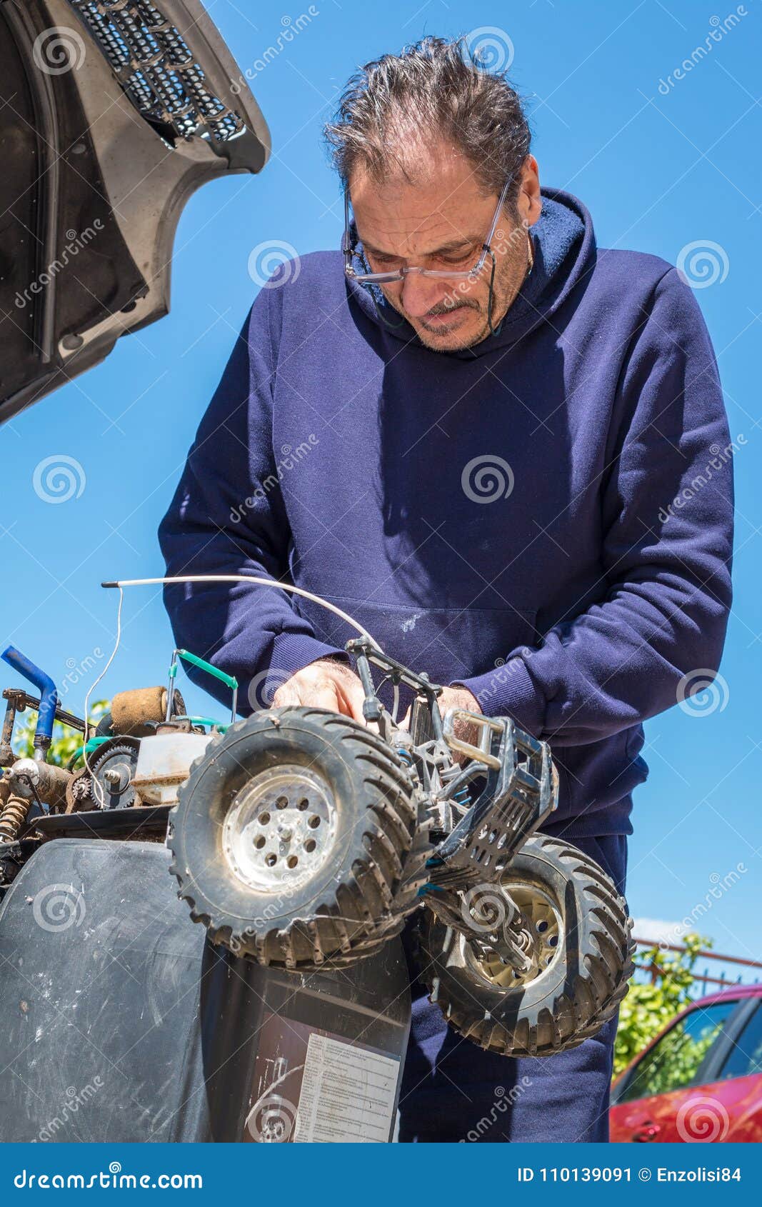 Mechanic working outdoors stock image. Image of profession - 110139091