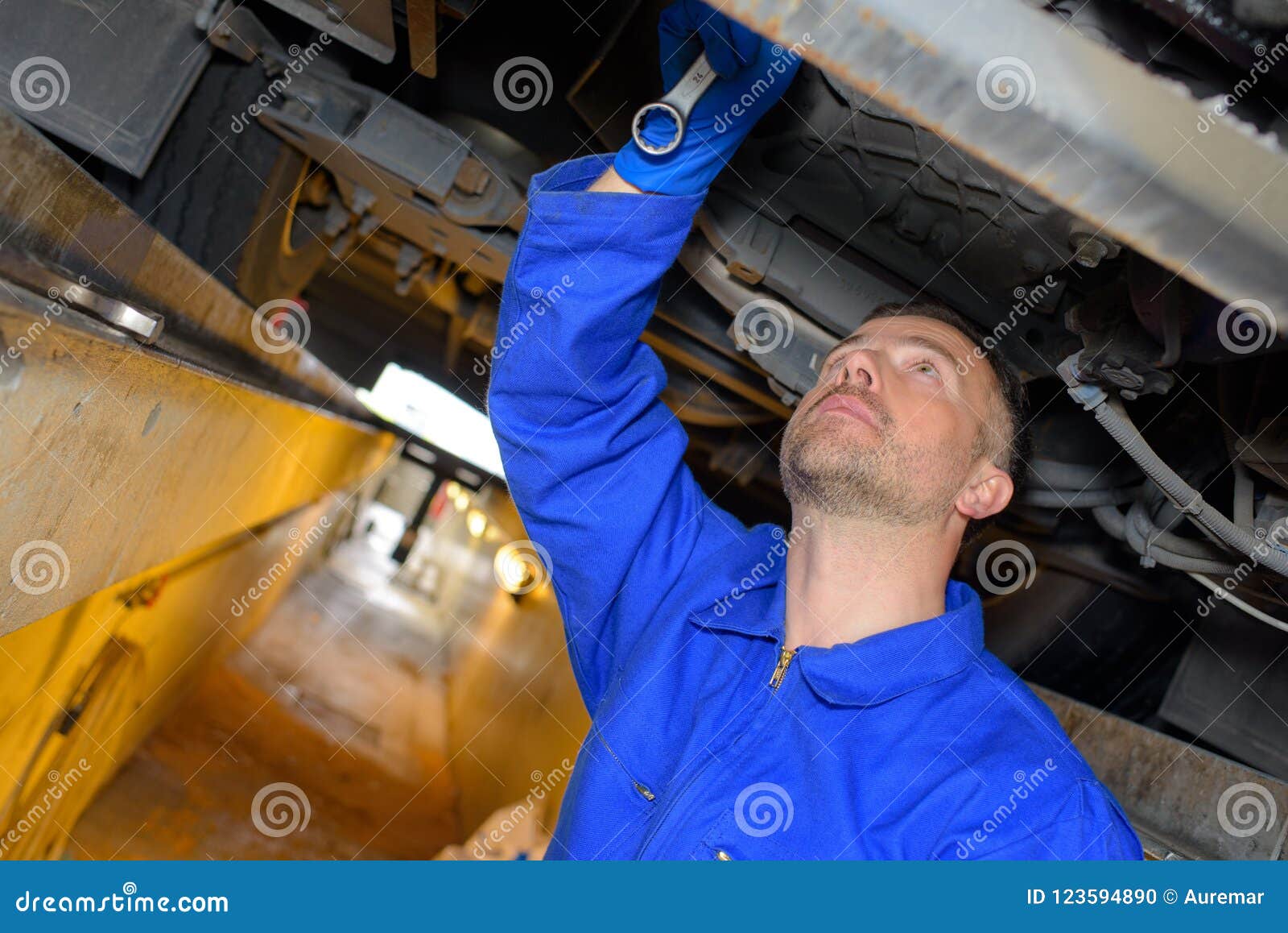 Mechanic working in pit stock photo. Image of chassis - 123594890