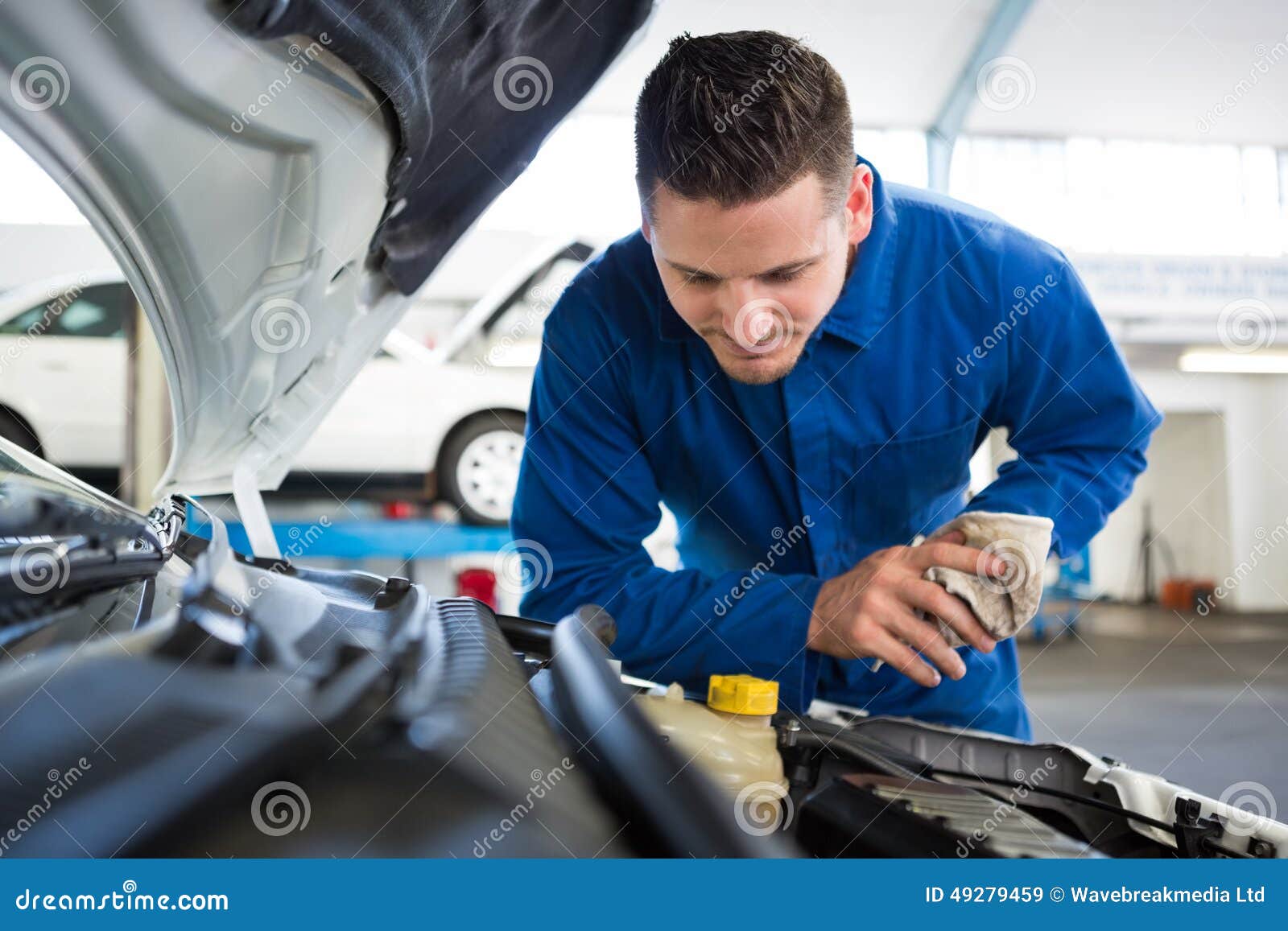 Mechanic Working Under the Hood Stock Image - Image of attentively ...