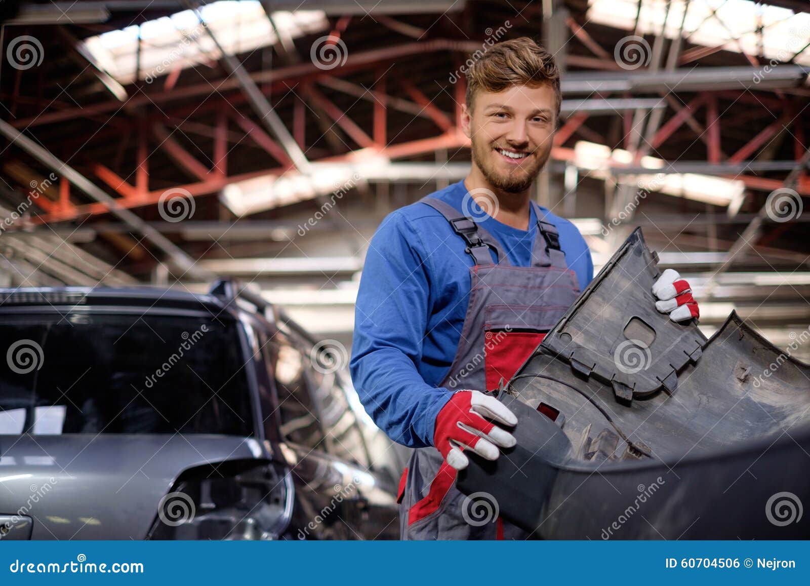 Mechanic in a workshop stock photo. Image of official - 60704506