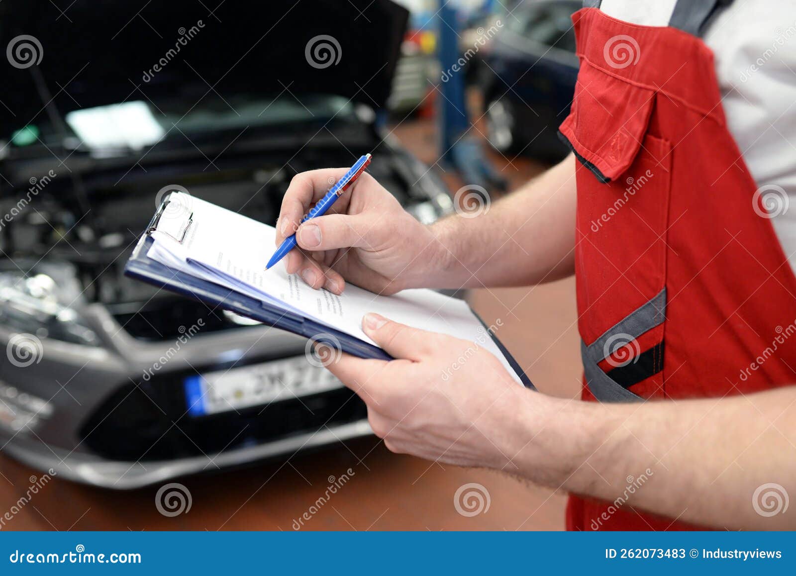 Mechanic in a Workshop Checks and Inspects a Vehicle for Defects Stock ...