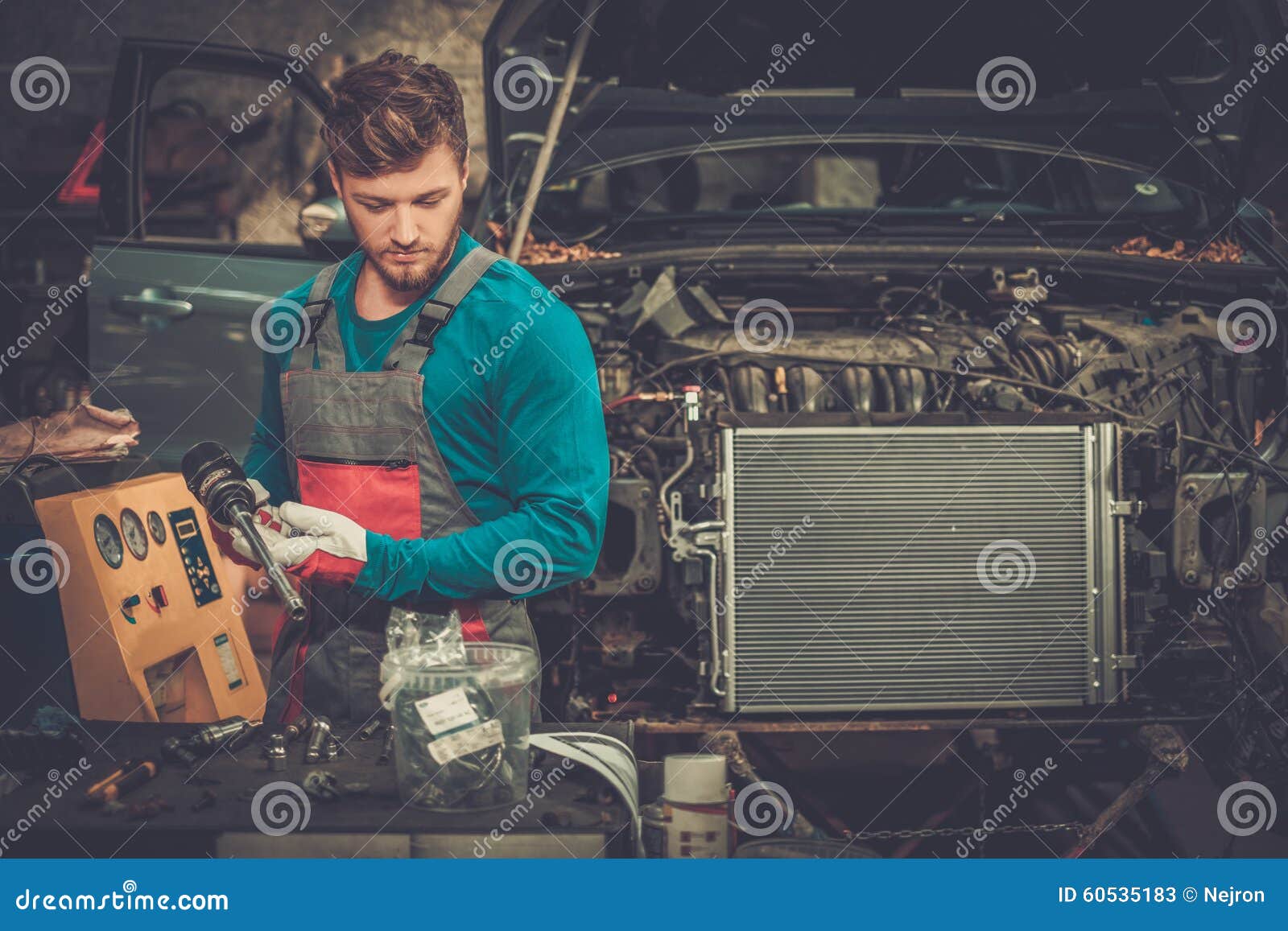 Mechanic in a workshop stock image. Image of mechanical - 60535183