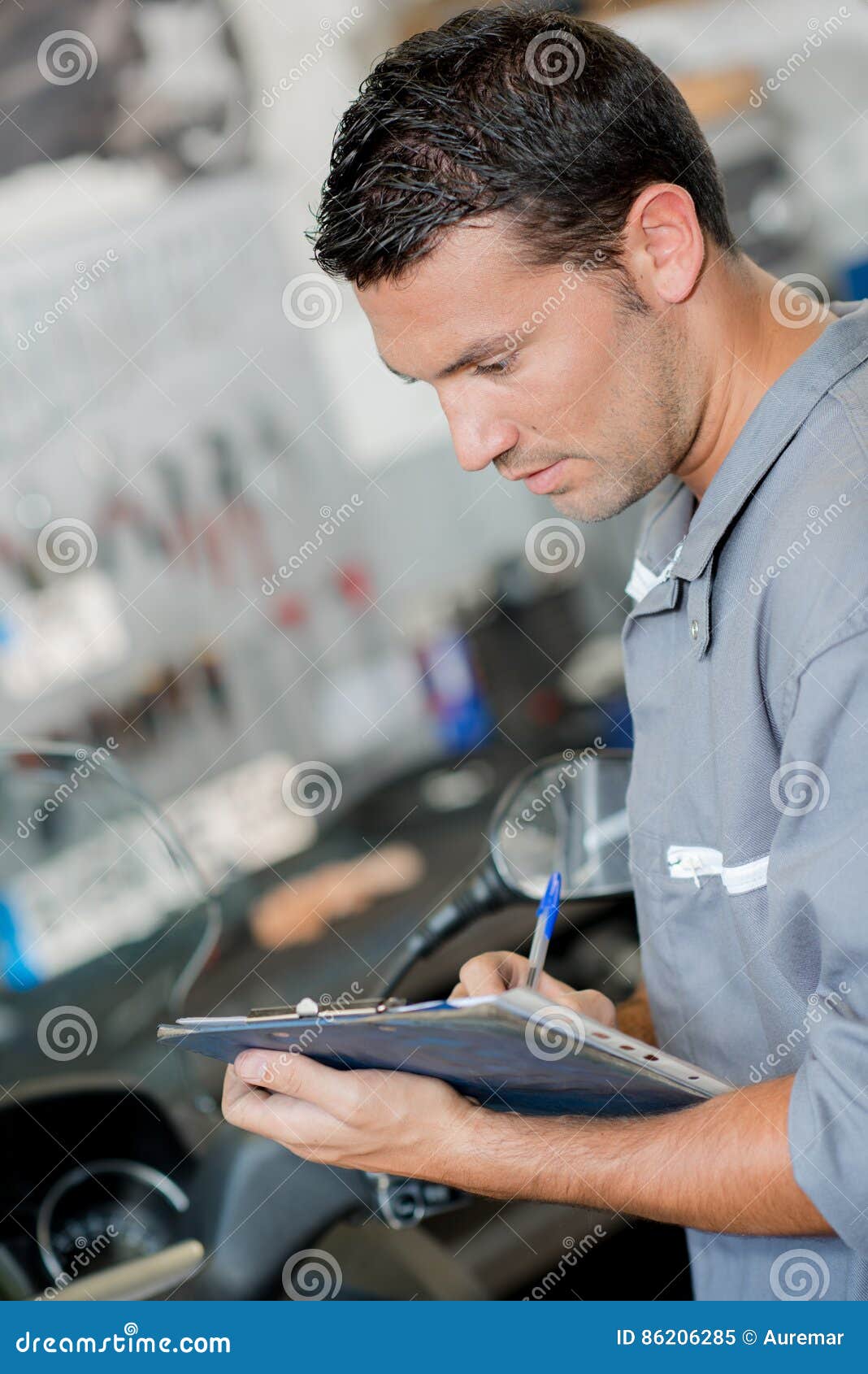 Mechanic Writing on Clipboard Stock Image - Image of worker, metal ...