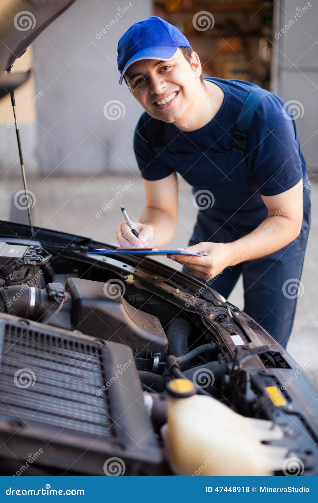 Mechanic Writing on a Clipboard Stock Photo - Image of tuning, service ...
