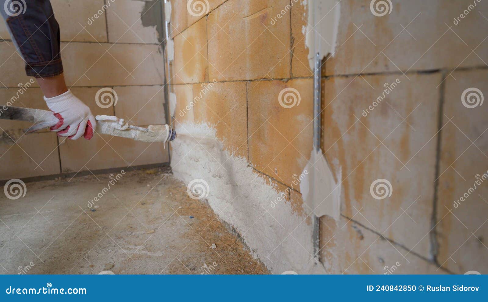 Mechanical Application of Mortar on the Wall. Application of Mortar on ...