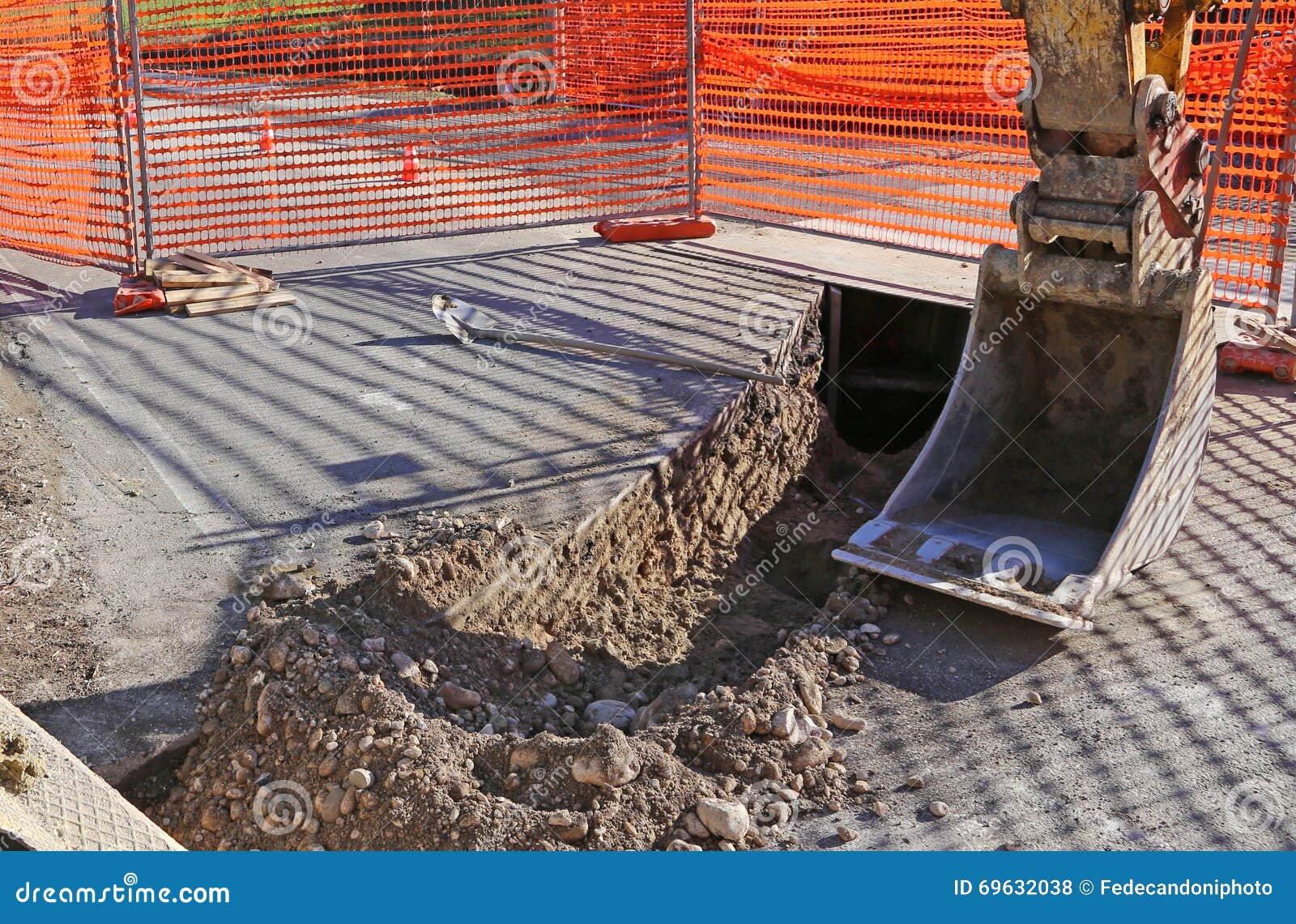 Mechanical Arm of the Digger in the Roadworks Bordered by Orange Stock ...