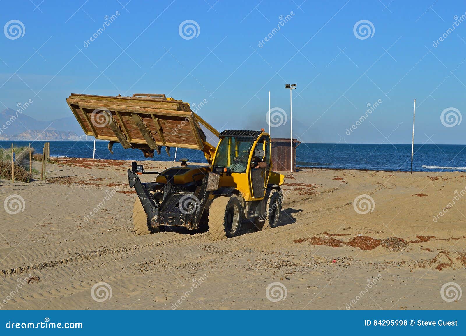 A Mechanical Digger Clearing a Beach Stock Photo - Image of beach, deep ...