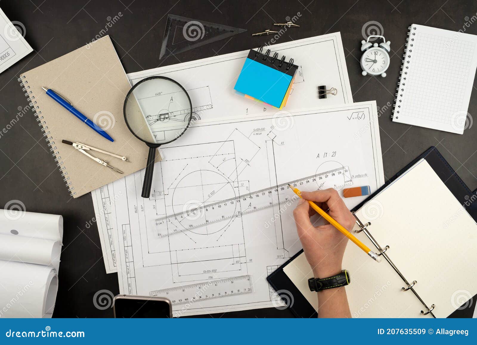 Mechanical Drawing on Sheets of Paper. Hands on the Table Top View ...