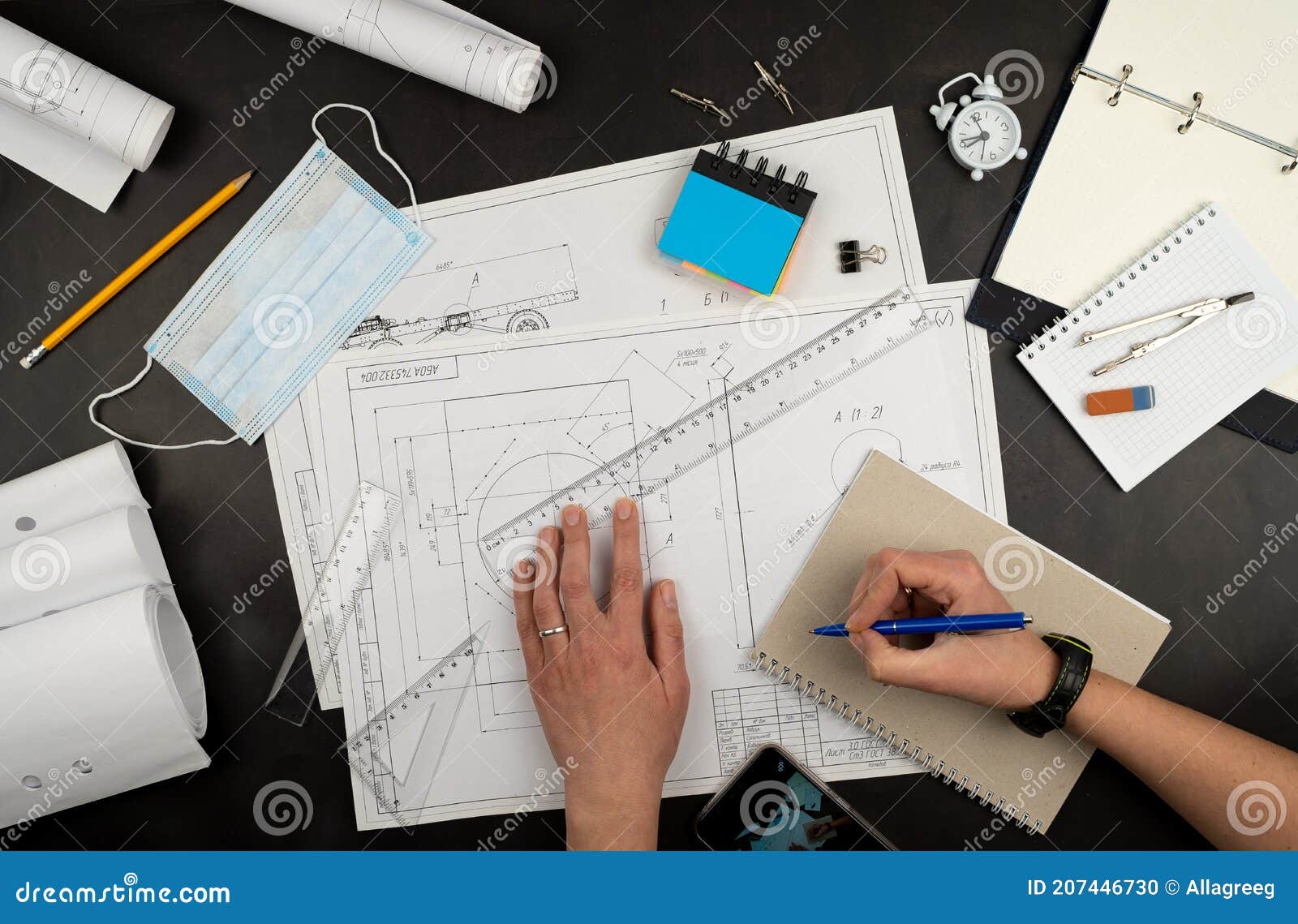 Mechanical Drawing on Sheets of Paper. Hands on the Table Top View ...