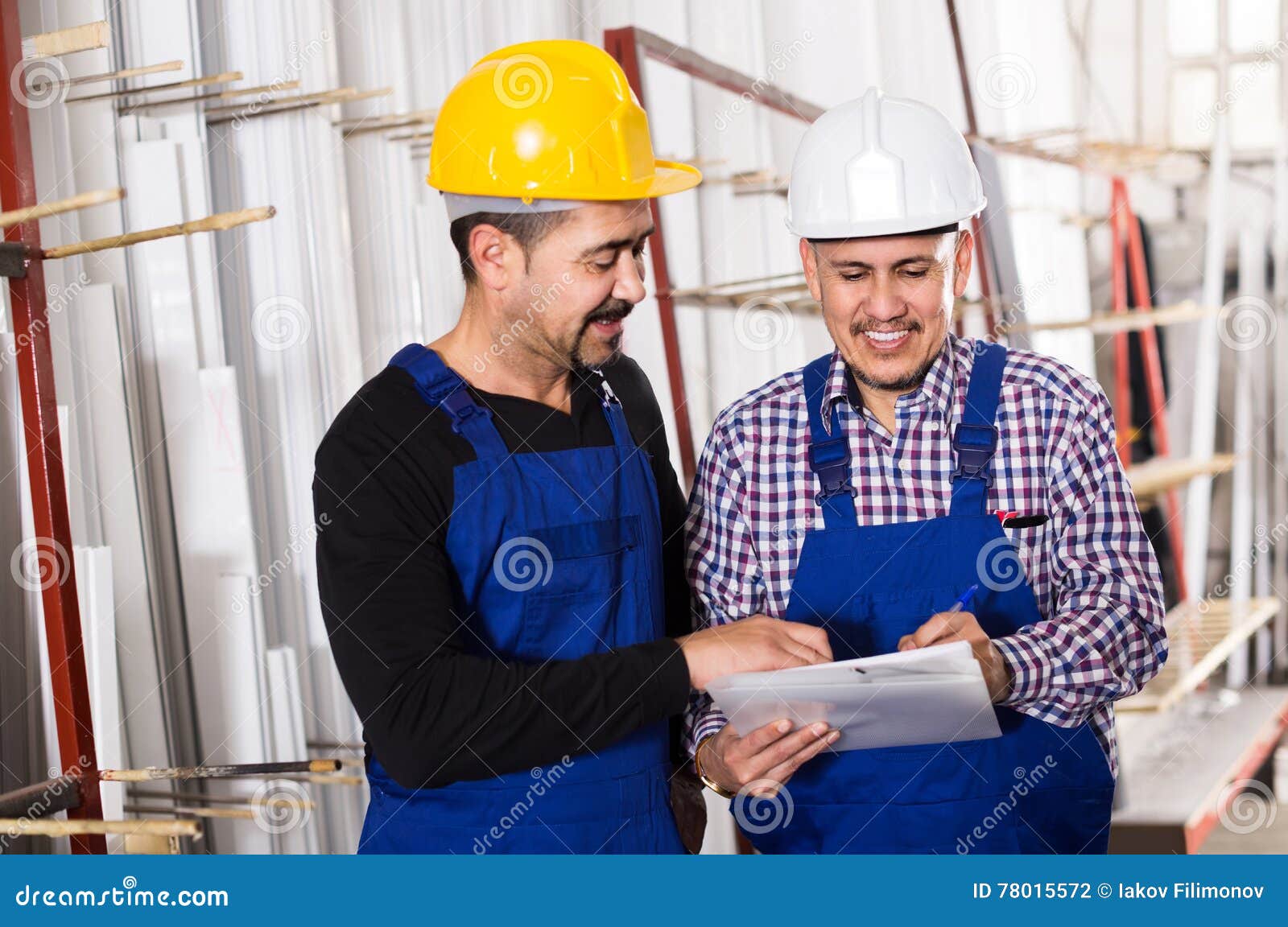 Mechanical Engineer Inspecting the Work of Labour at Factory Stock ...