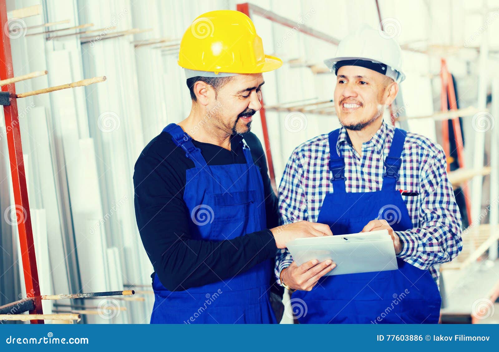 Mechanical Engineer Inspecting the Work of Labour at Factory Stock ...