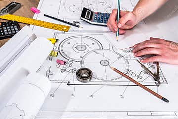 Mechanical Engineer with Work at Technical Drawings and Work Tools ...