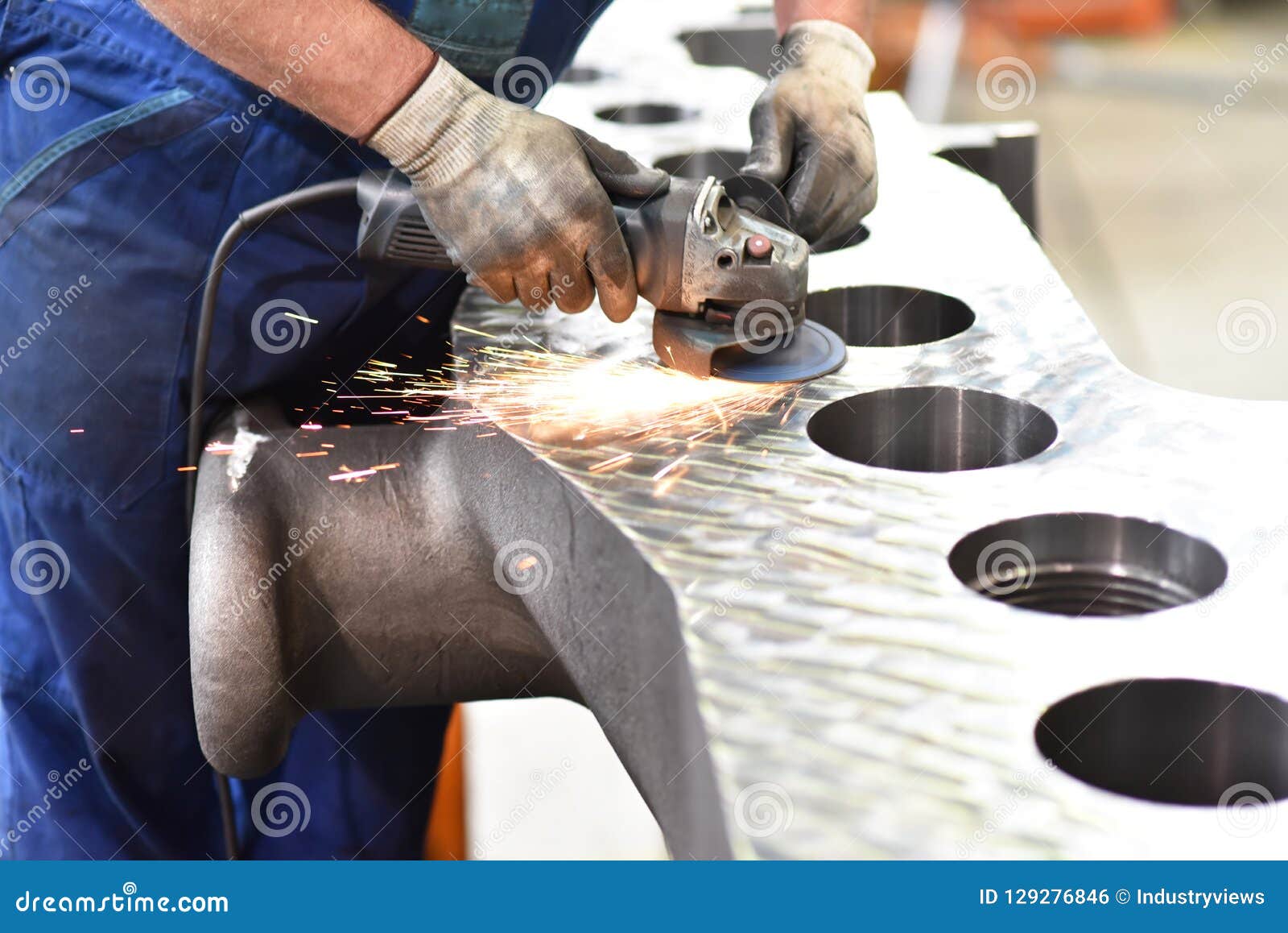Mechanical Engineering Worker Grinds Metal with Machine during C Stock ...