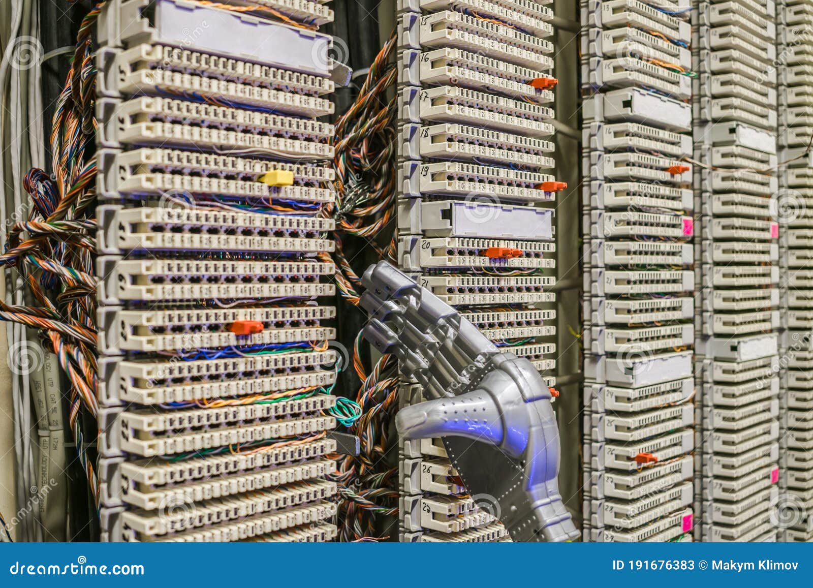 A Mechanical Hand is Next To the Ip Telephony Patch Panel. the Robot ...